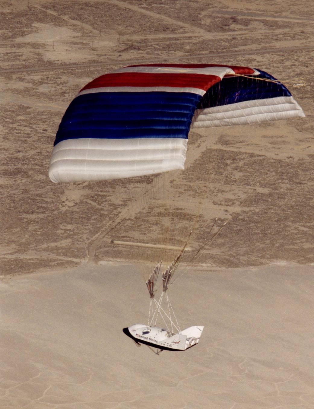 X-38 Descends to Lakebed Landing under its Steerable Parafoil - NASA
