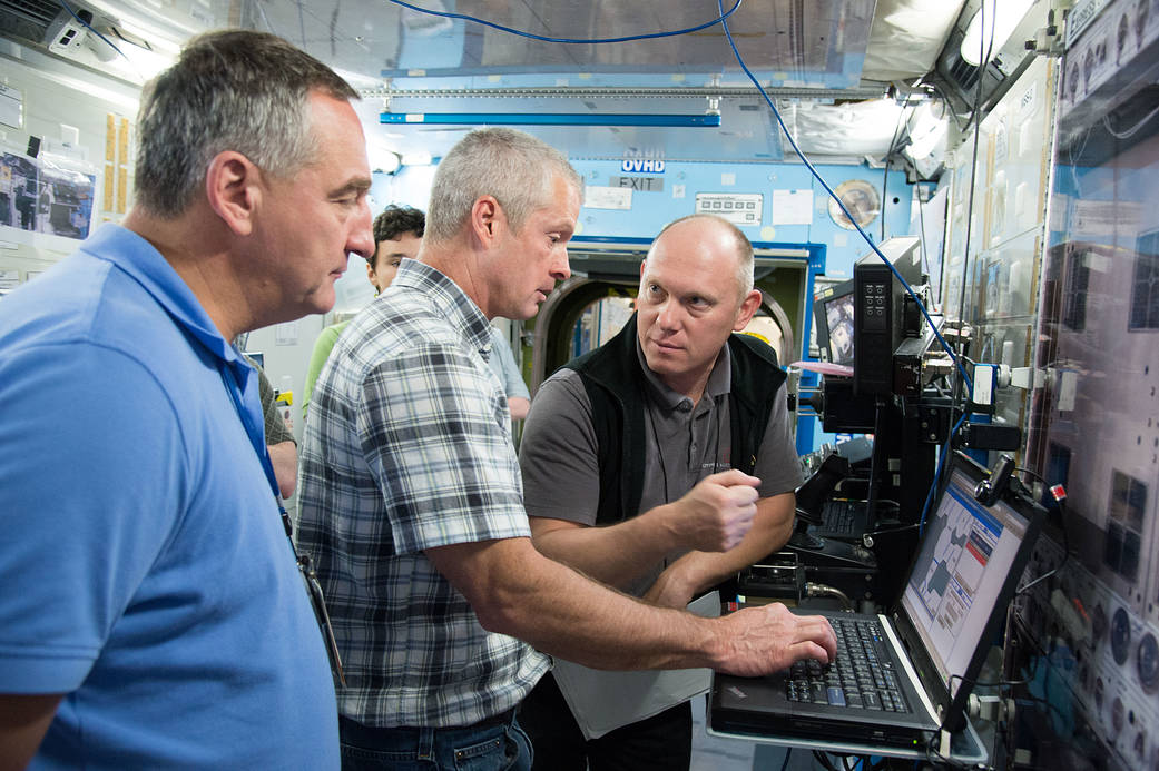Steve Swanson, Alexander Skvortsov and Oleg Artemyev - NASA