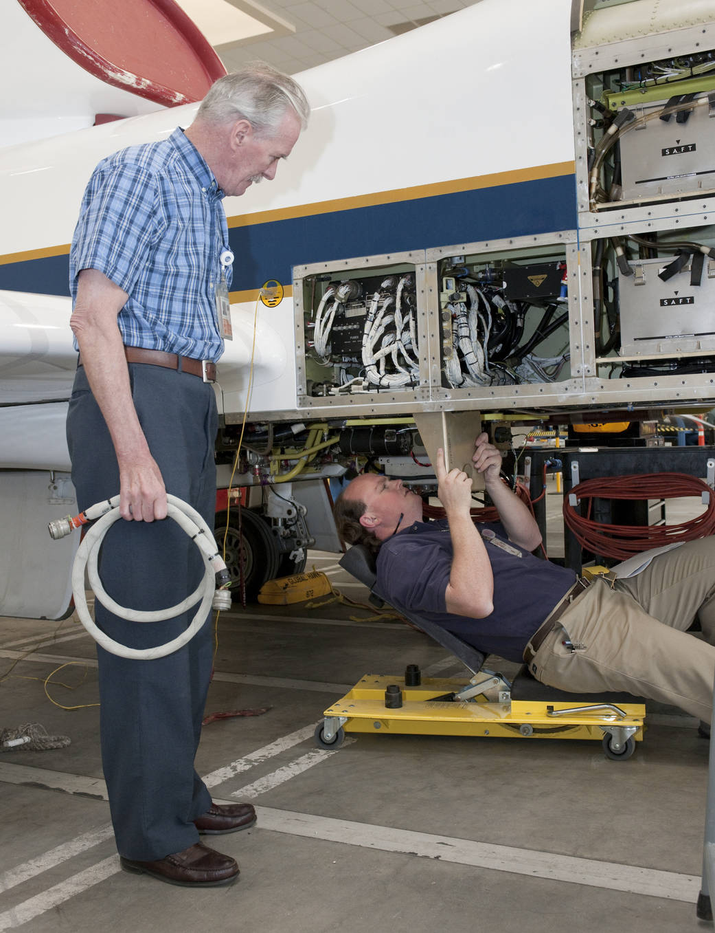 Technicians Measure Mounts to Install Scientific Equipment - NASA