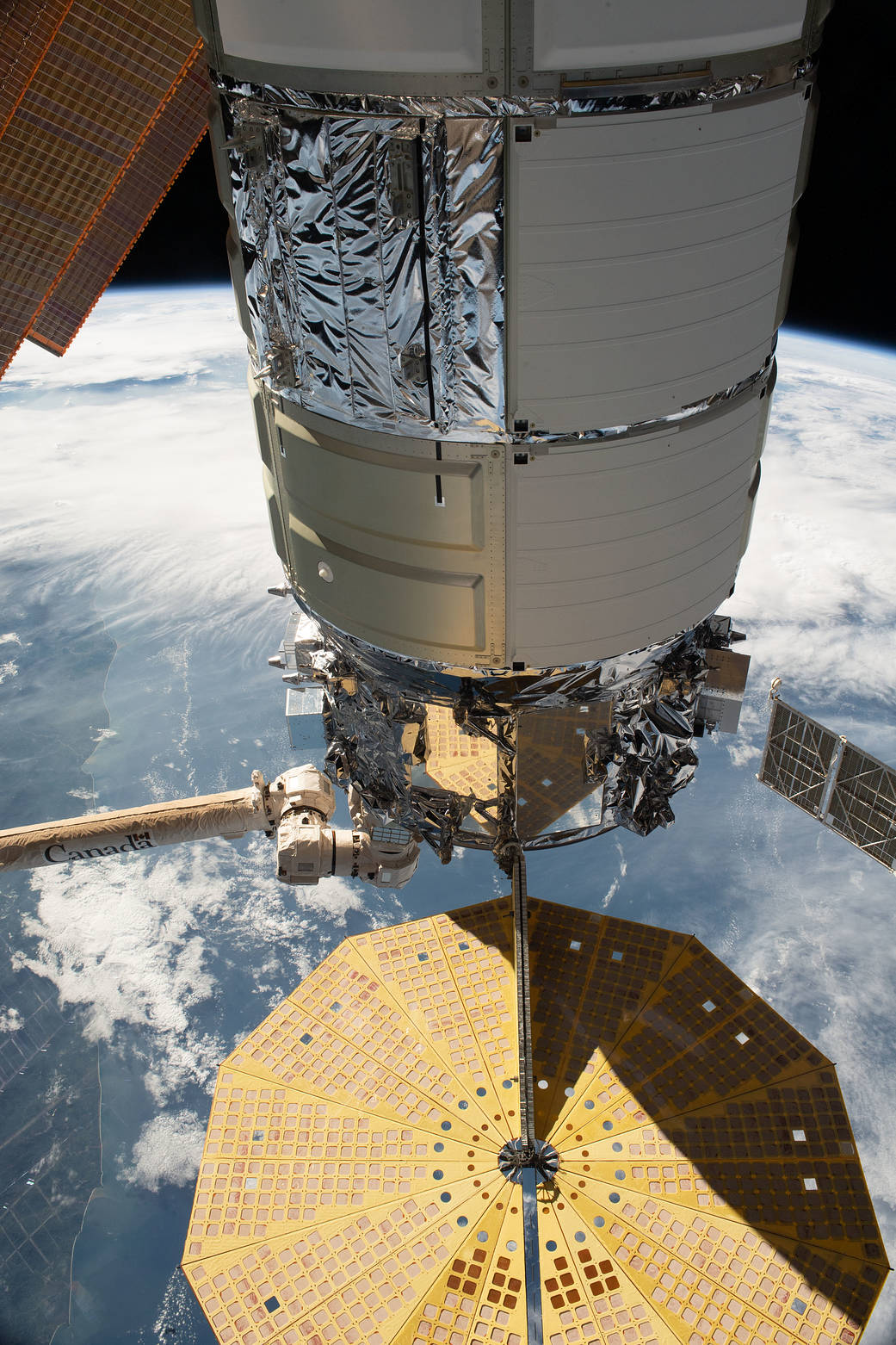 Cygnus in the grips of the Canadarm2 robotic arm - NASA