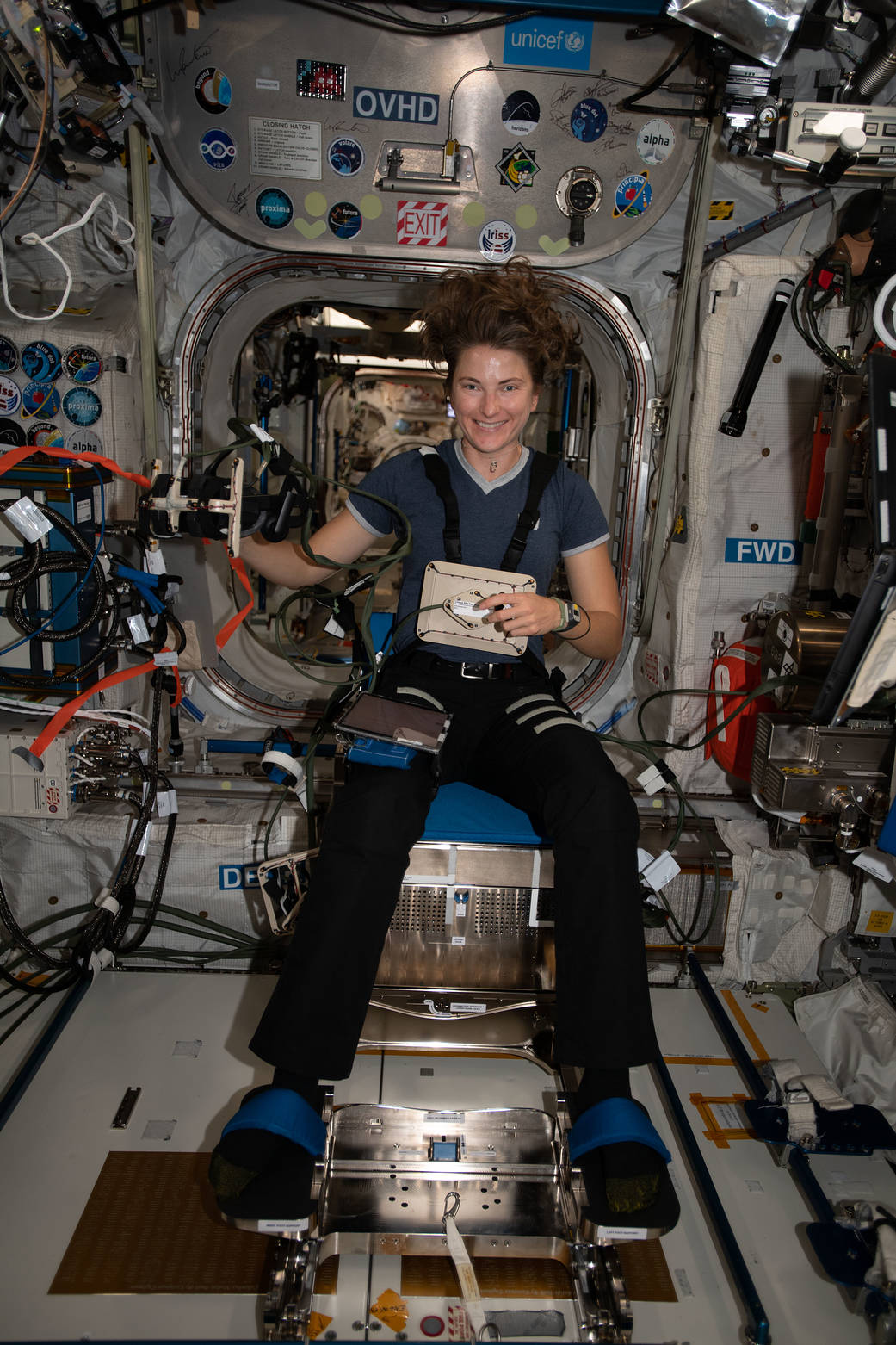 Astronaut Kayla Barron sits in a specialized chair for the GRASP ...